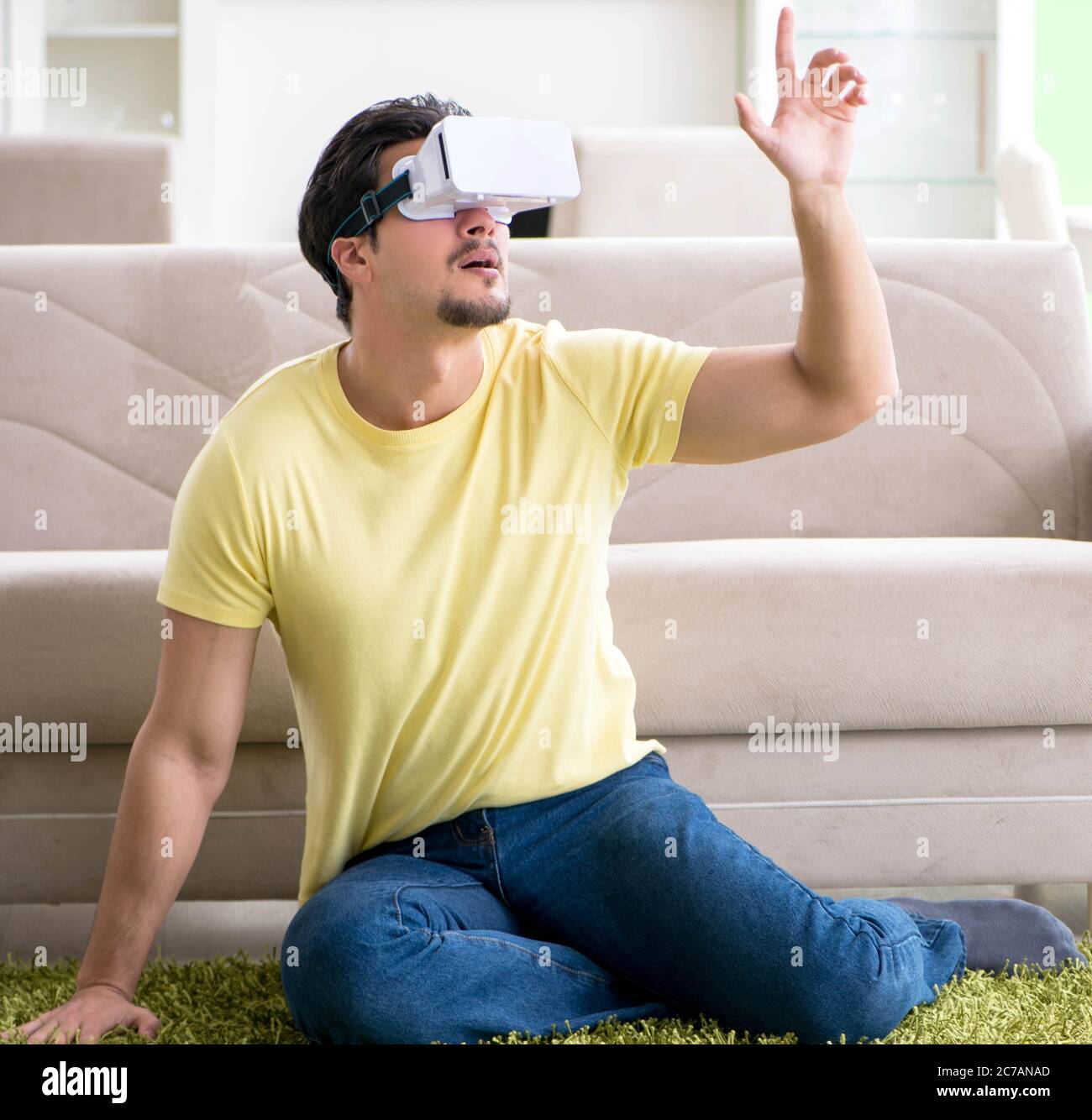 The young man with virtual reality goggles Stock Photo - Alamy