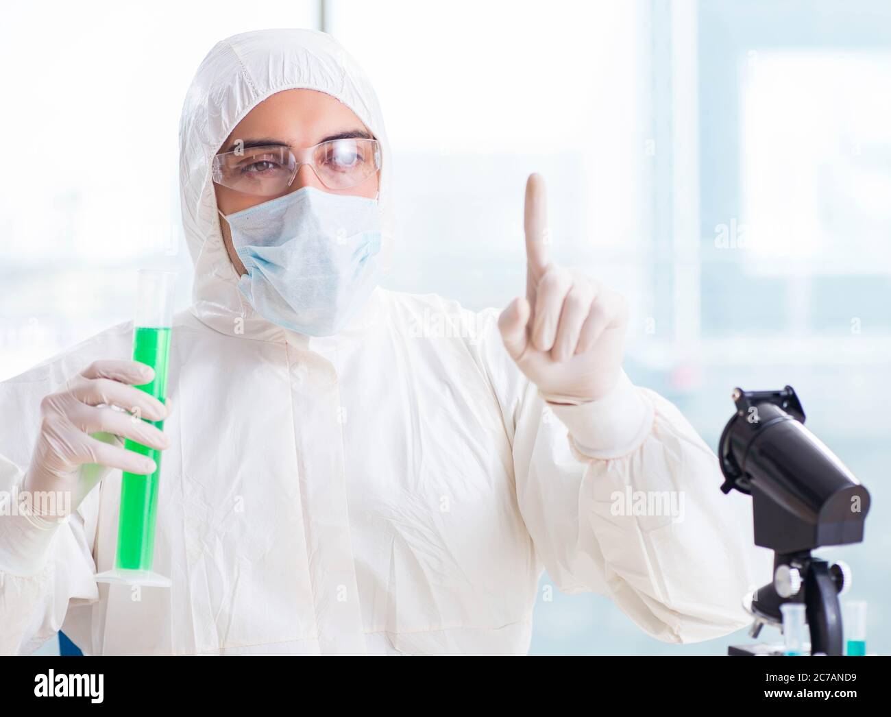 The young chemist pressing virtual buttons in lab Stock Photo - Alamy