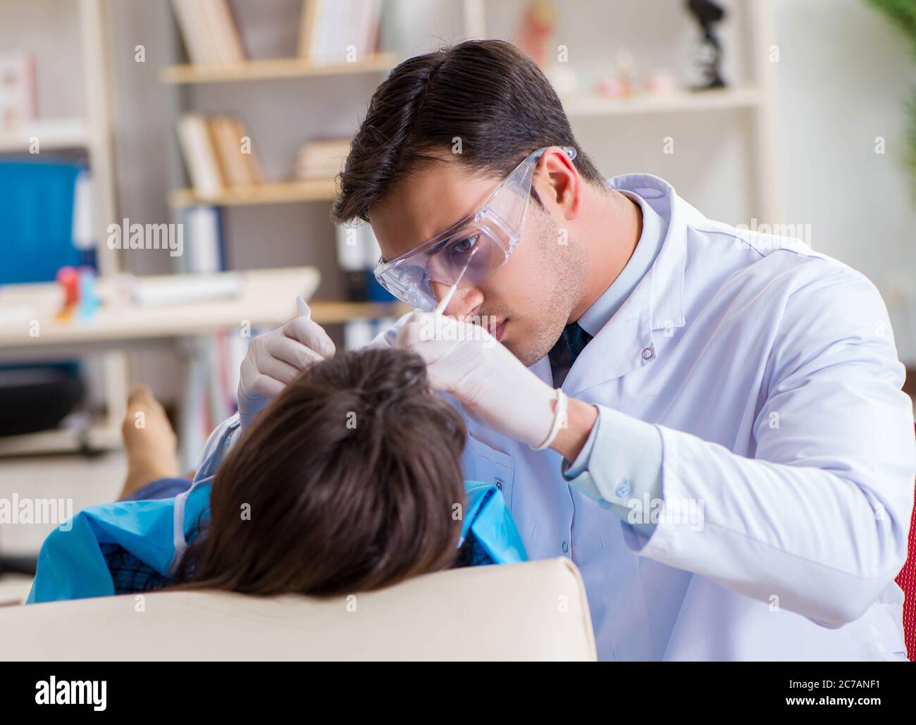 The patient visiting dentist for regular check-up and filling Stock ...