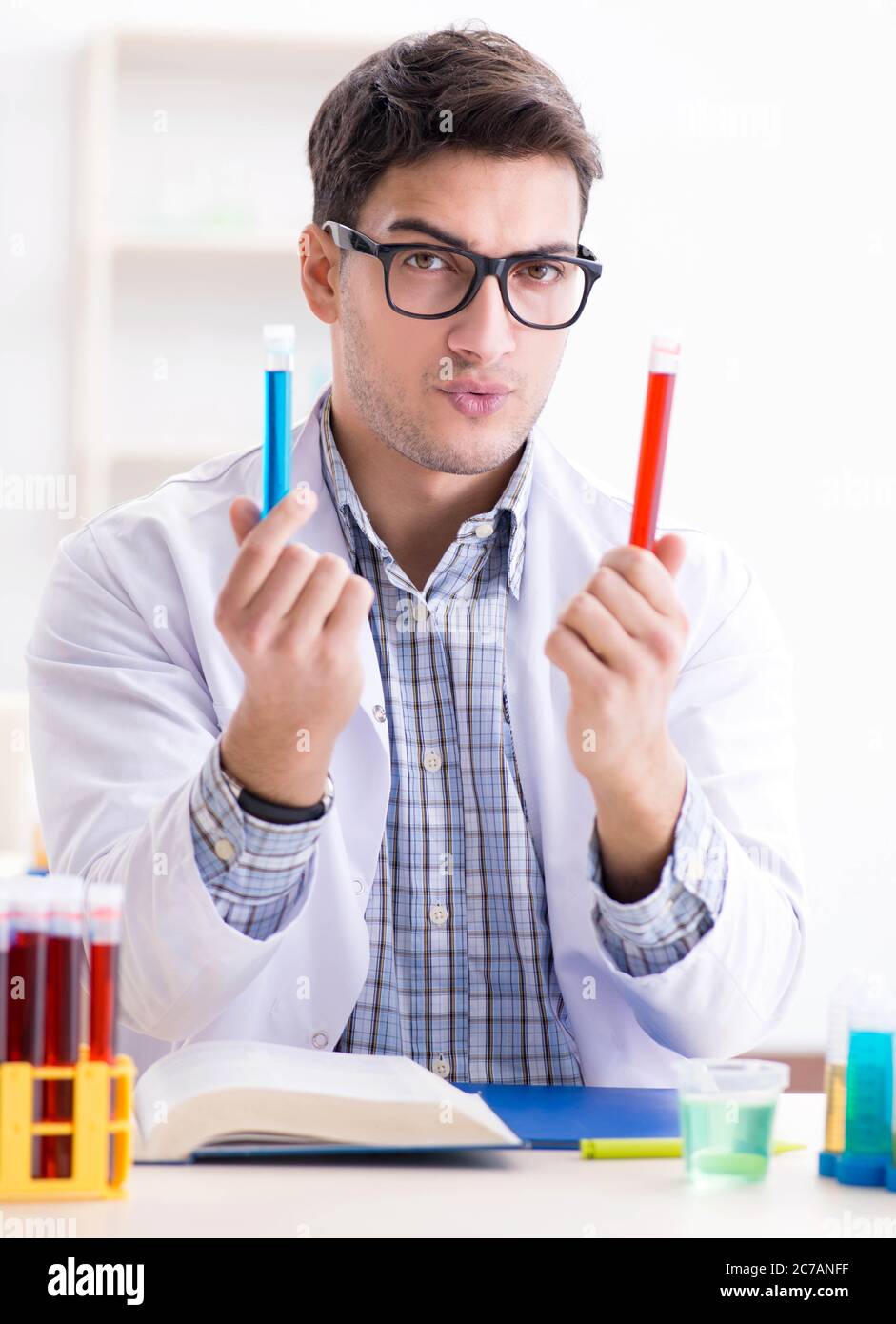 Chemistry student doing chemical experiments at classroom activity ...