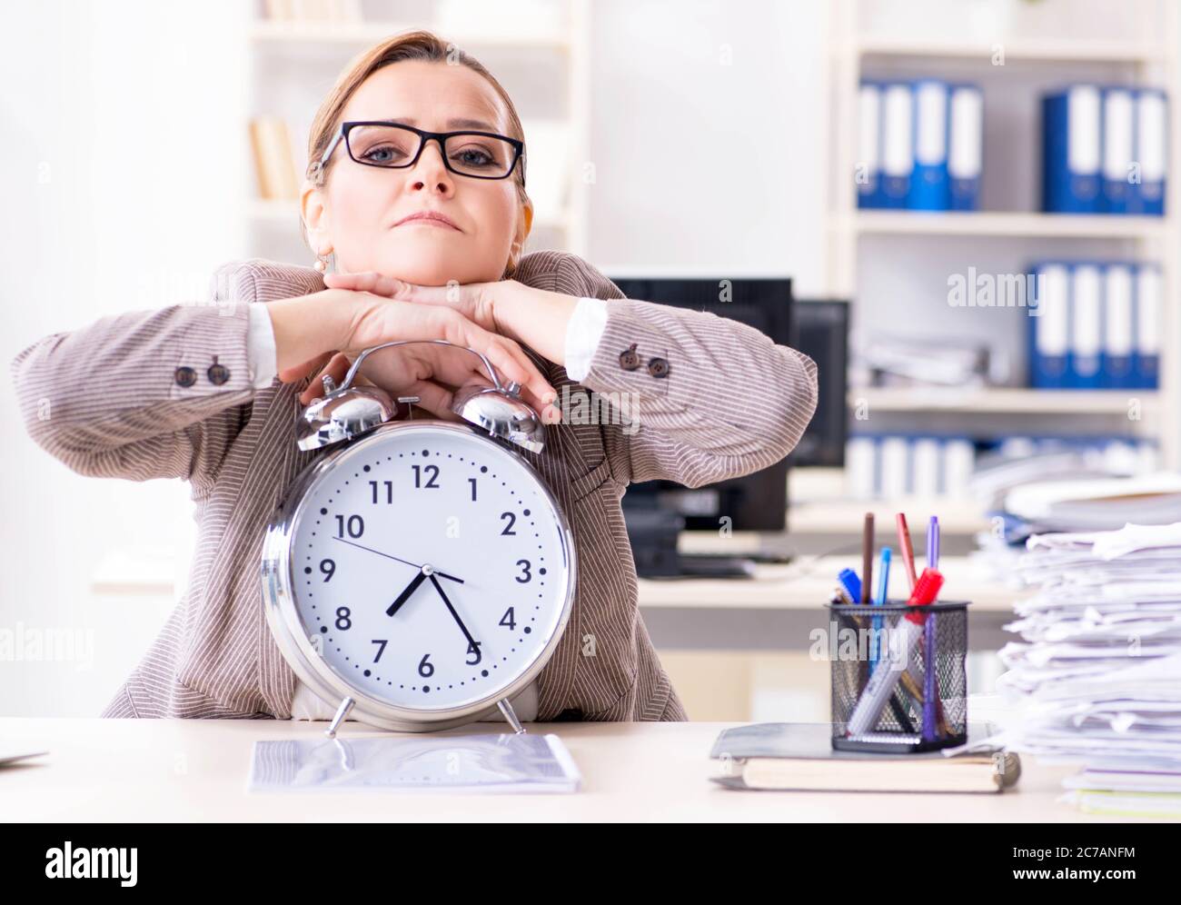 The businesswoman workaholic trying to finish urgent paperwork Stock ...