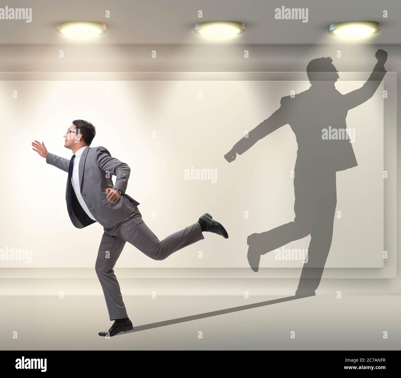 The businessman and his shadow in business concept Stock Photo - Alamy
