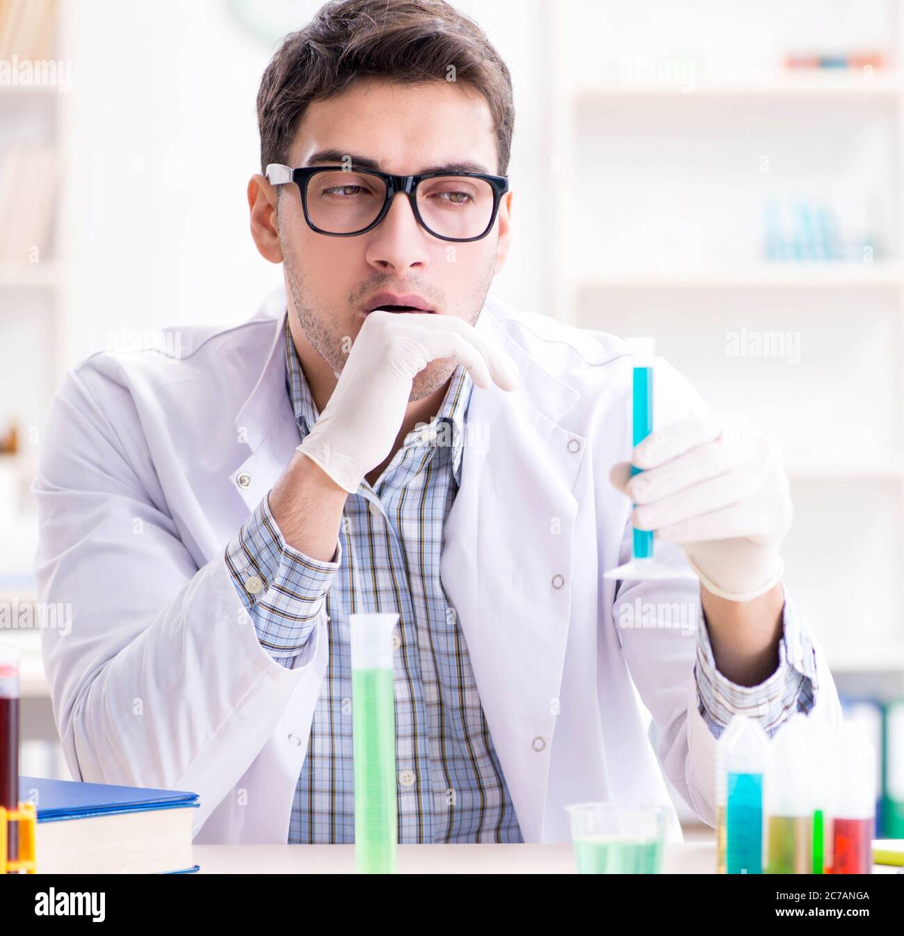 Chemistry student doing chemical experiments at classroom activity ...