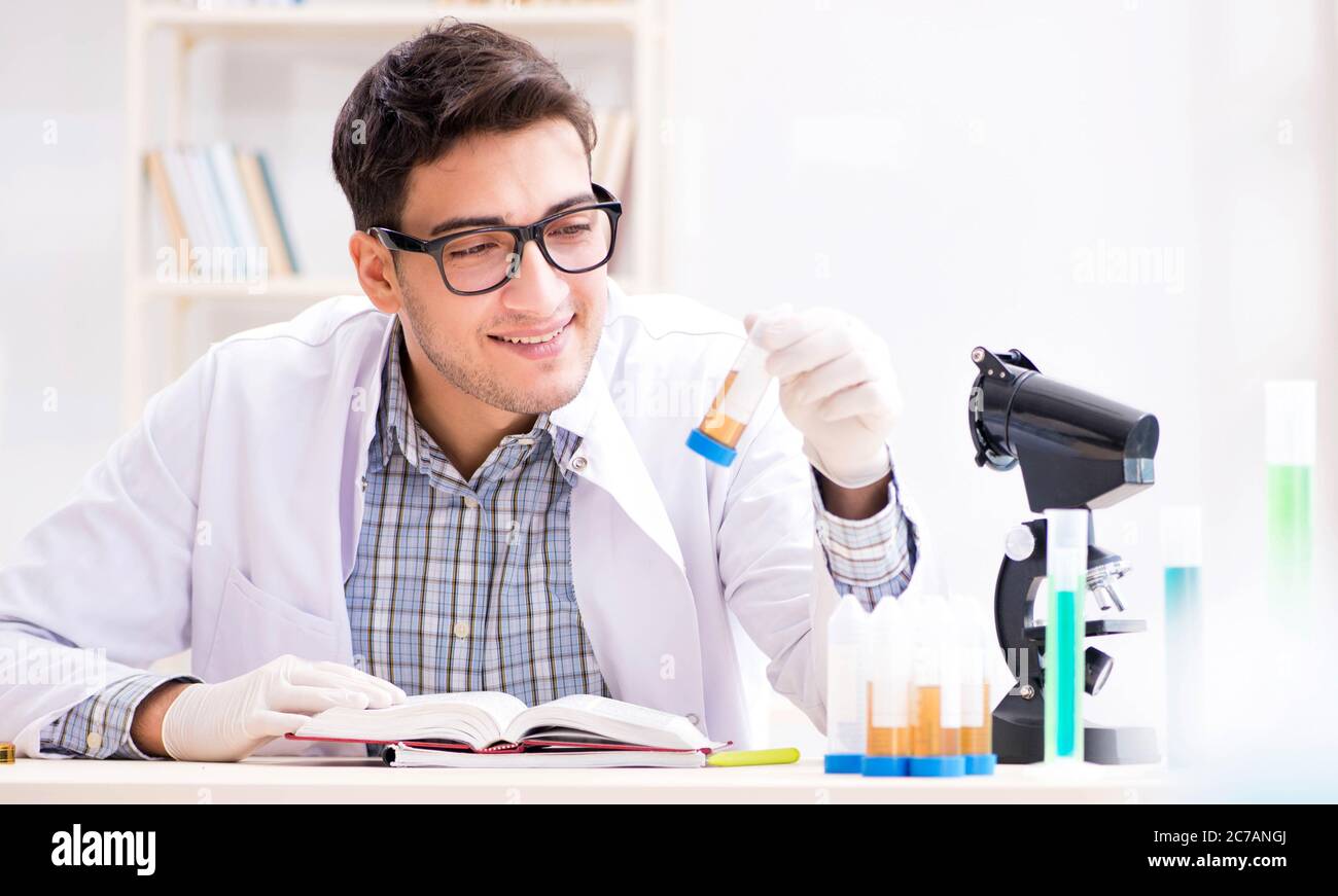 Chemistry student doing chemical experiments at classroom activity ...
