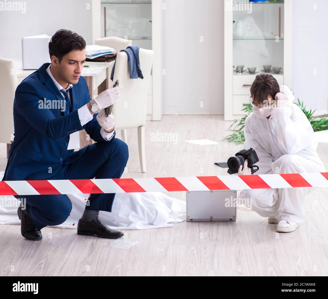 The forensics investigator at the scene of office crime Stock Photo - Alamy