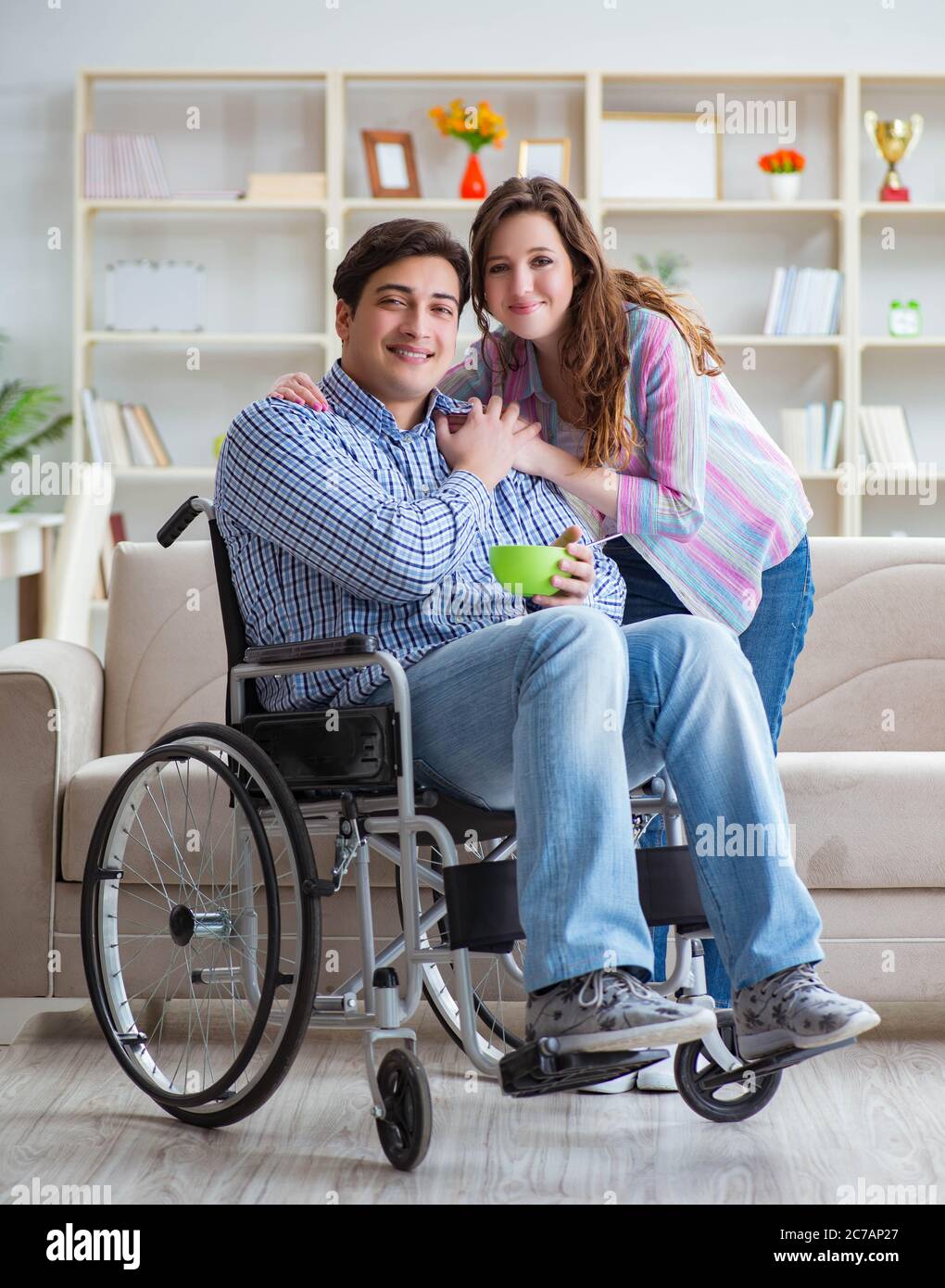 The young family taking care of each other Stock Photo - Alamy