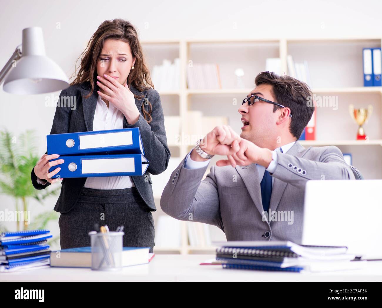 The angry boss unhappy with female employee performance Stock Photo - Alamy