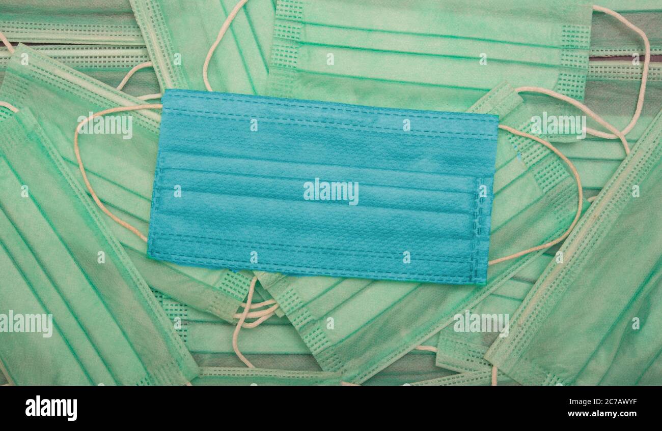 Multiple number of face masks making background - covid-19 pandemic ...