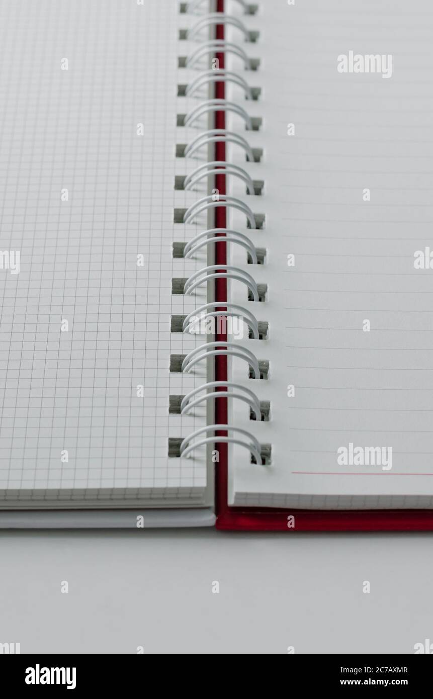 Wirebound Notebook Open with Lined and Grid Paper Stock Photo - Alamy