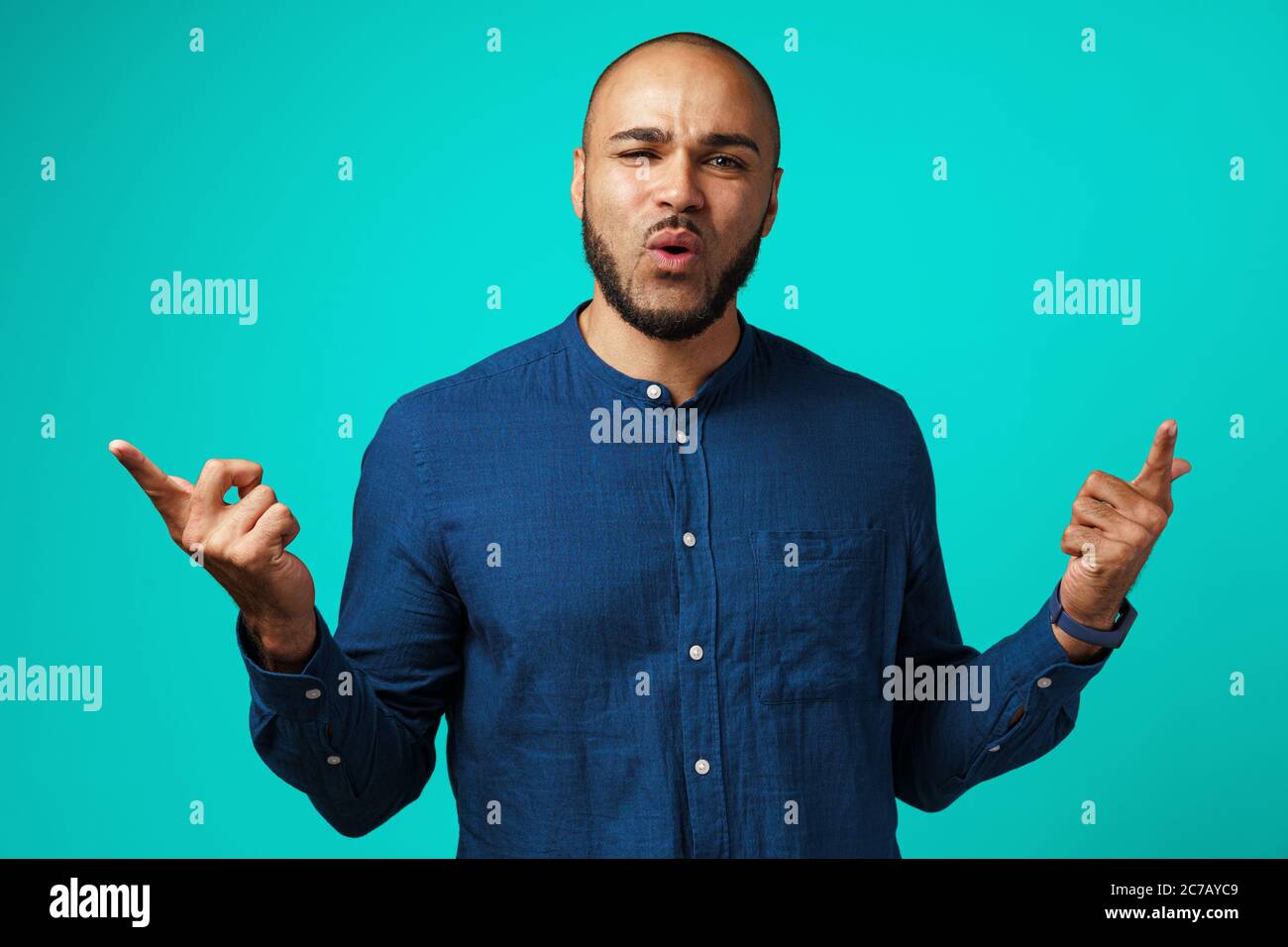 Portrait of a happy black man celebrating his success expressing joy ...
