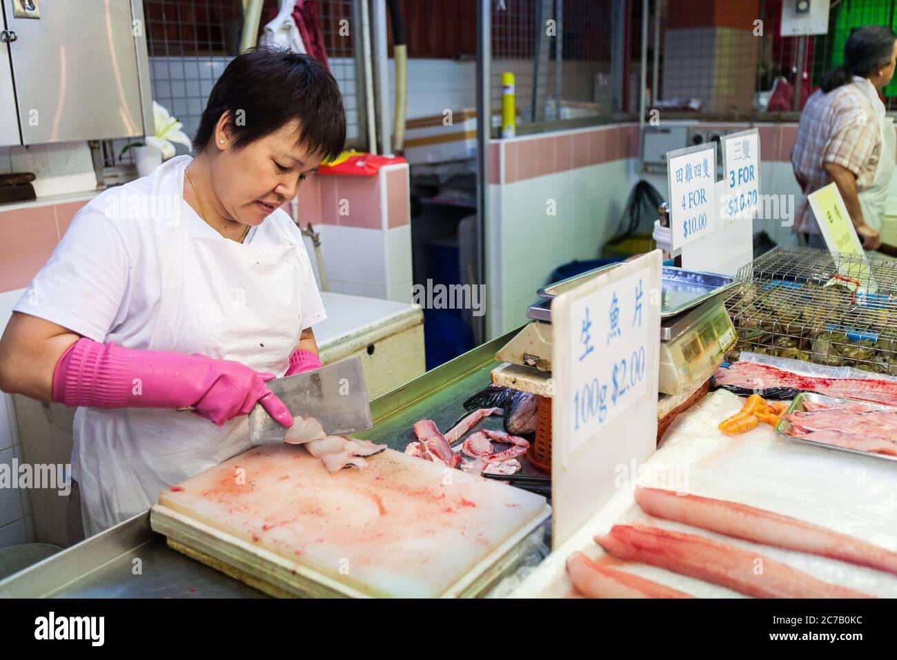 Woman fishmonger fish hi-res stock photography and images - Alamy