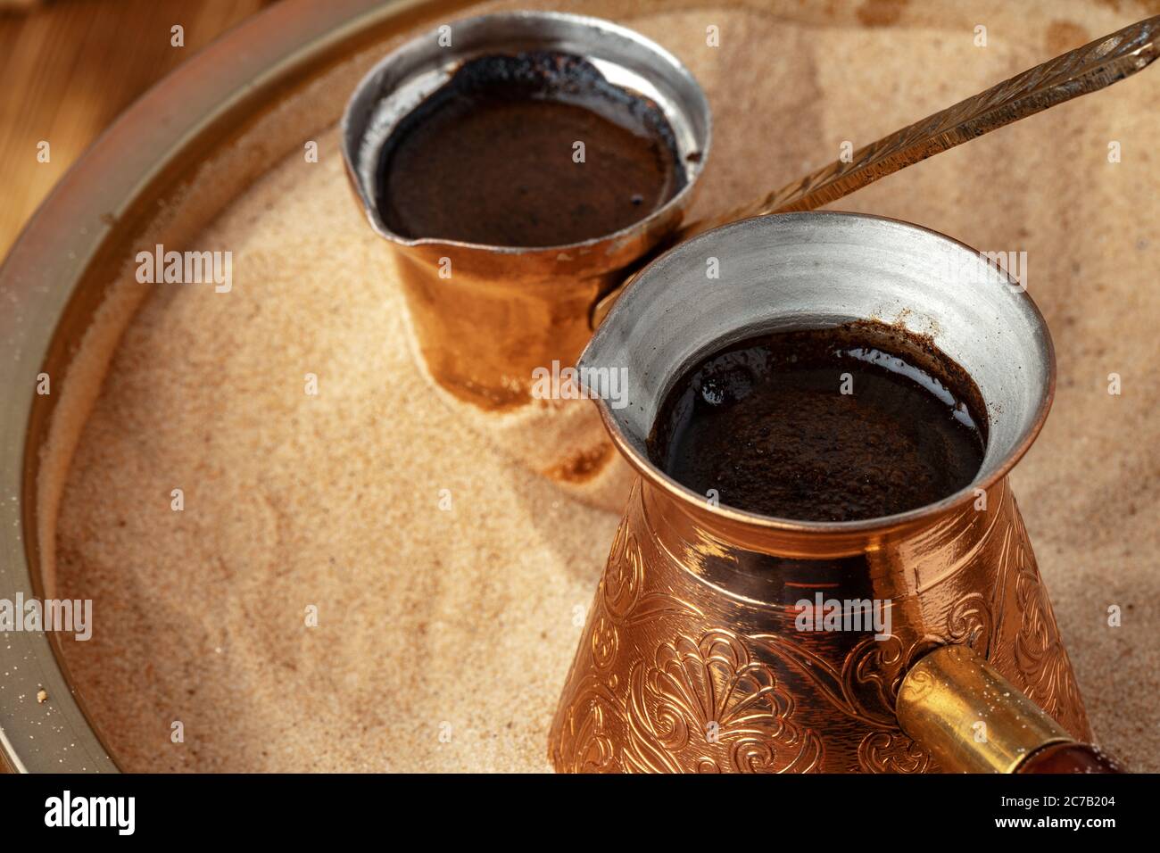 Process of preparation of coffee in turk in cezve on sand Stock Photo ...