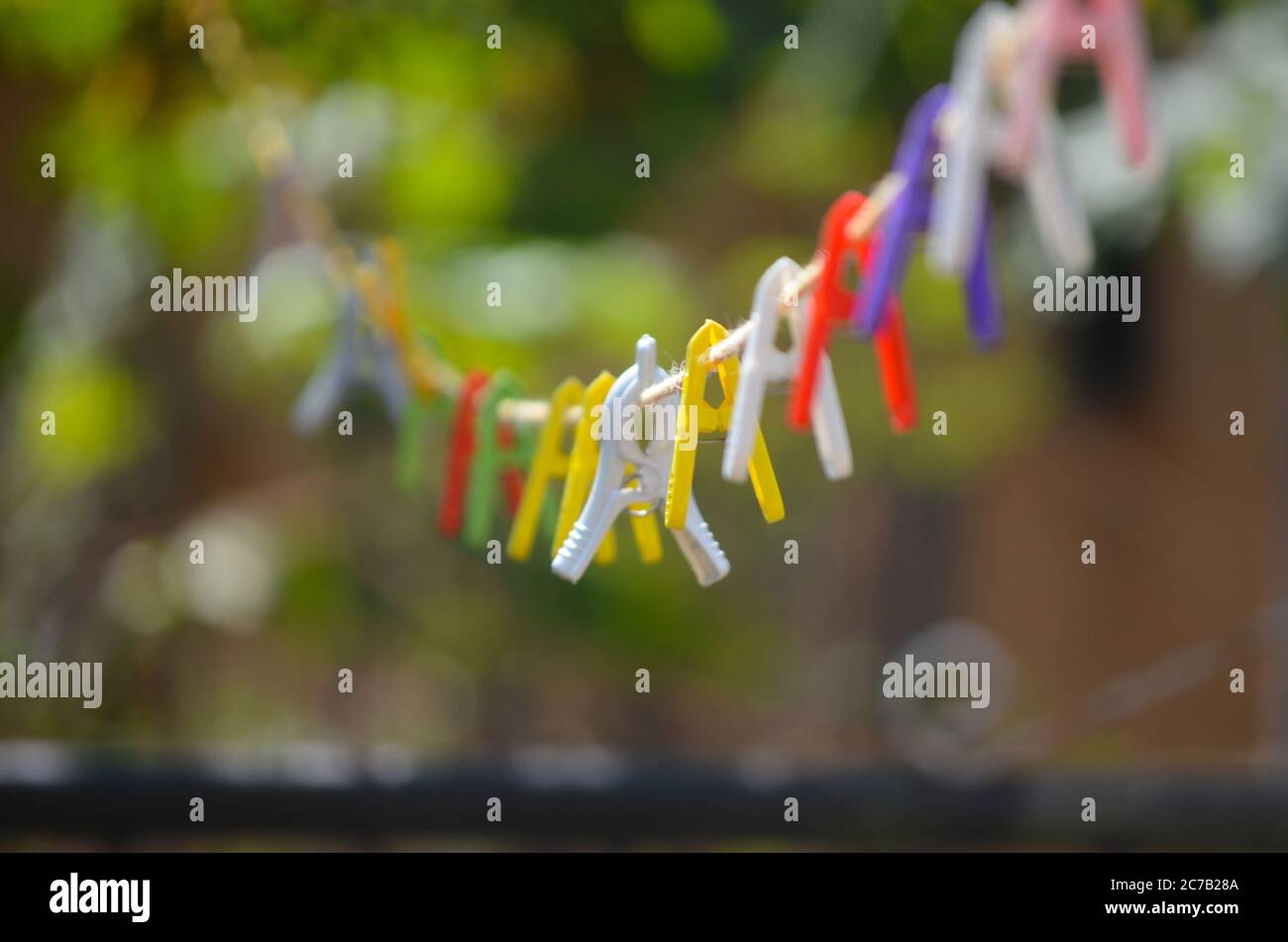 English alphabet A, Hanging clips, focus Stock Photo - Alamy