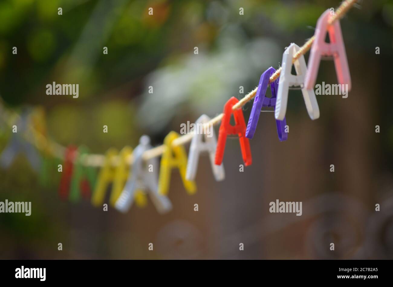 English alphabet A, Hanging clips, focus Stock Photo - Alamy