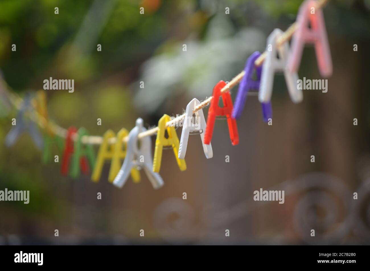 English alphabet A, Hanging clips, focus Stock Photo - Alamy