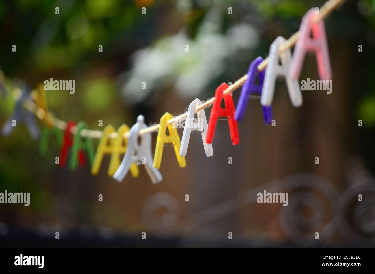 English alphabet A, Hanging clips, focus Stock Photo - Alamy