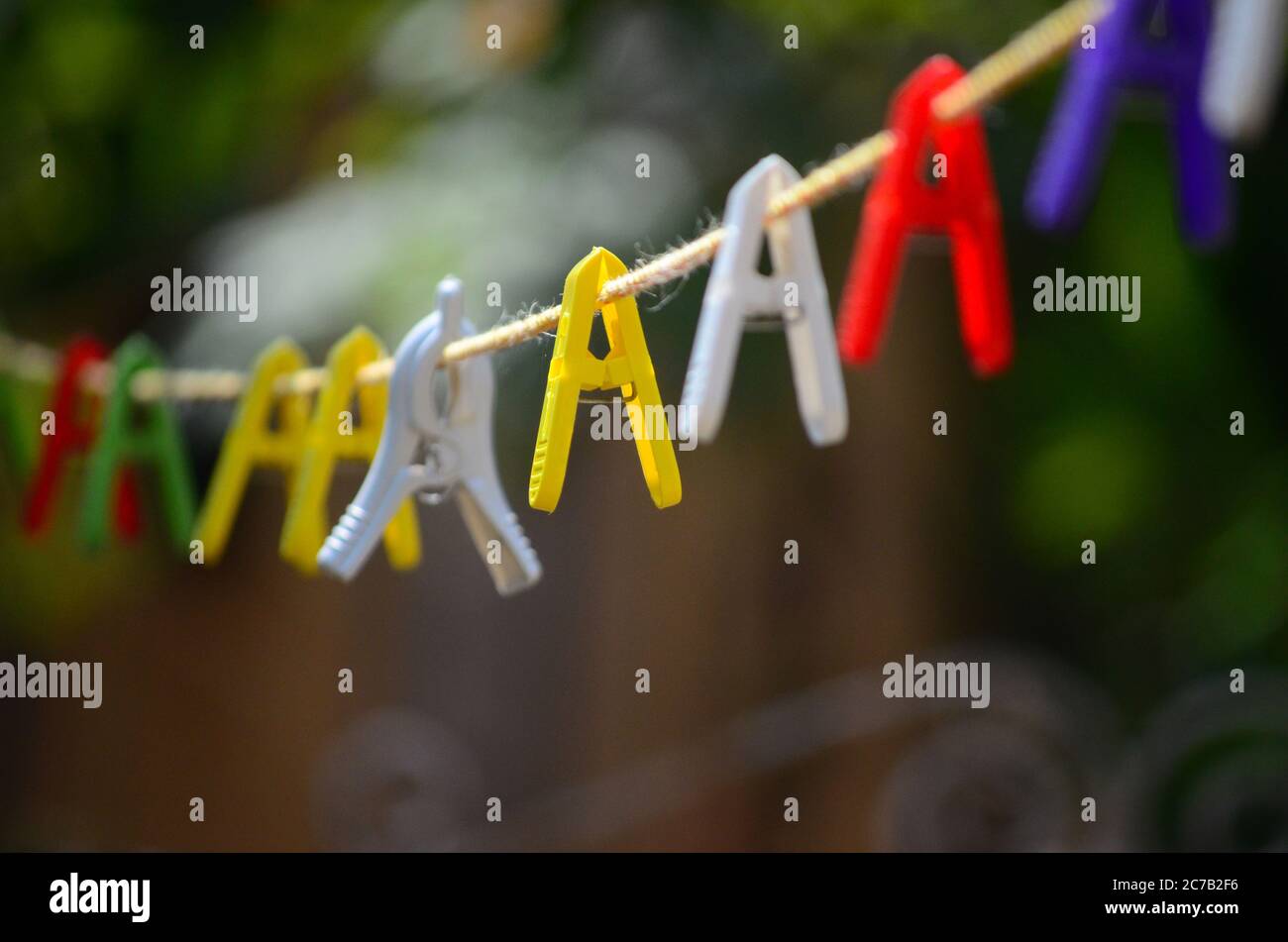 English alphabet A, Hanging clips, focus Stock Photo - Alamy
