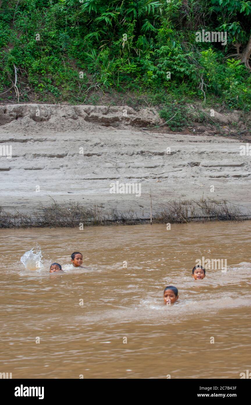 Kids Swimming In A River