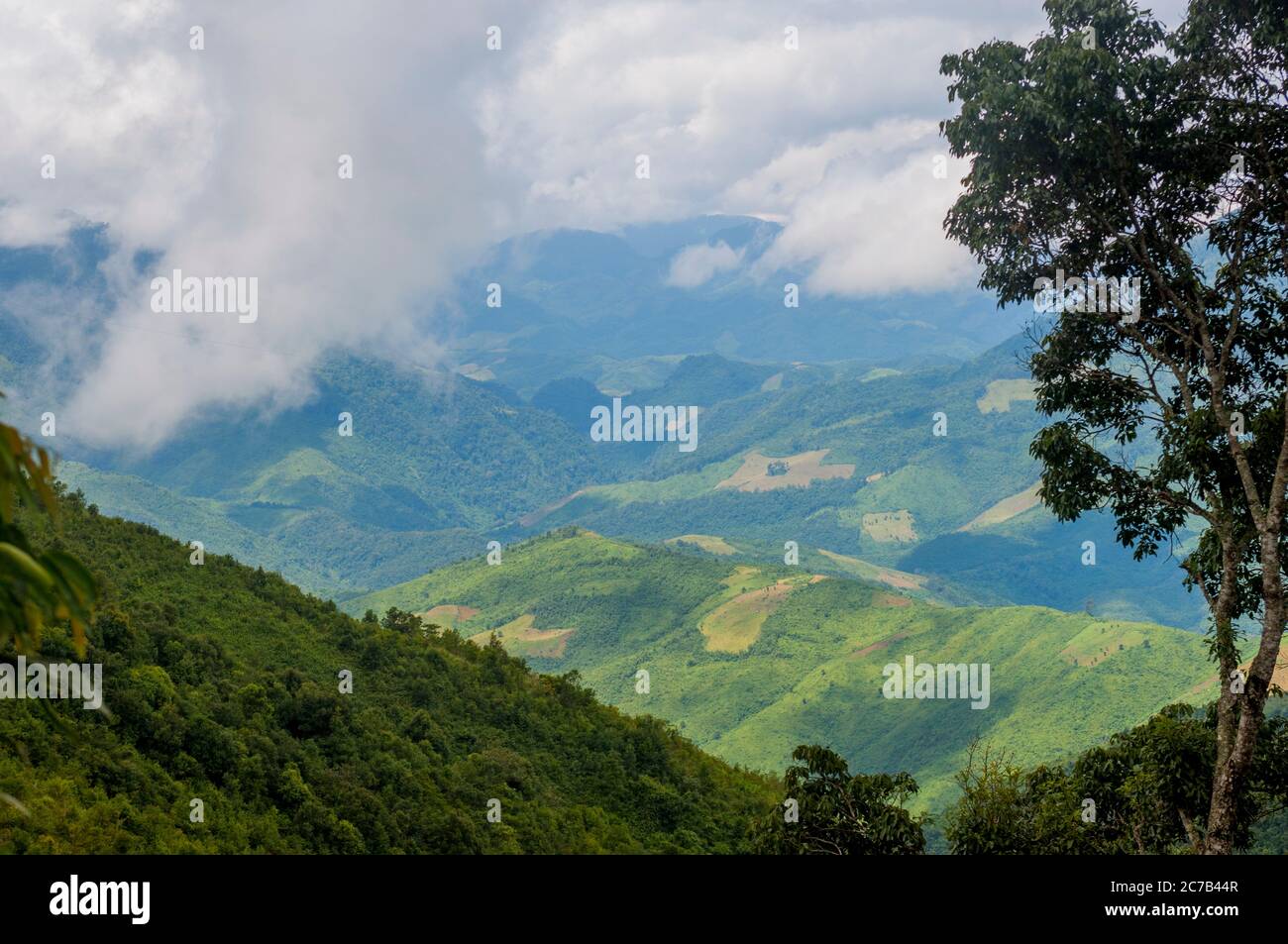 Clouds are clearing after rain in the hill country near Luang Prabang ...