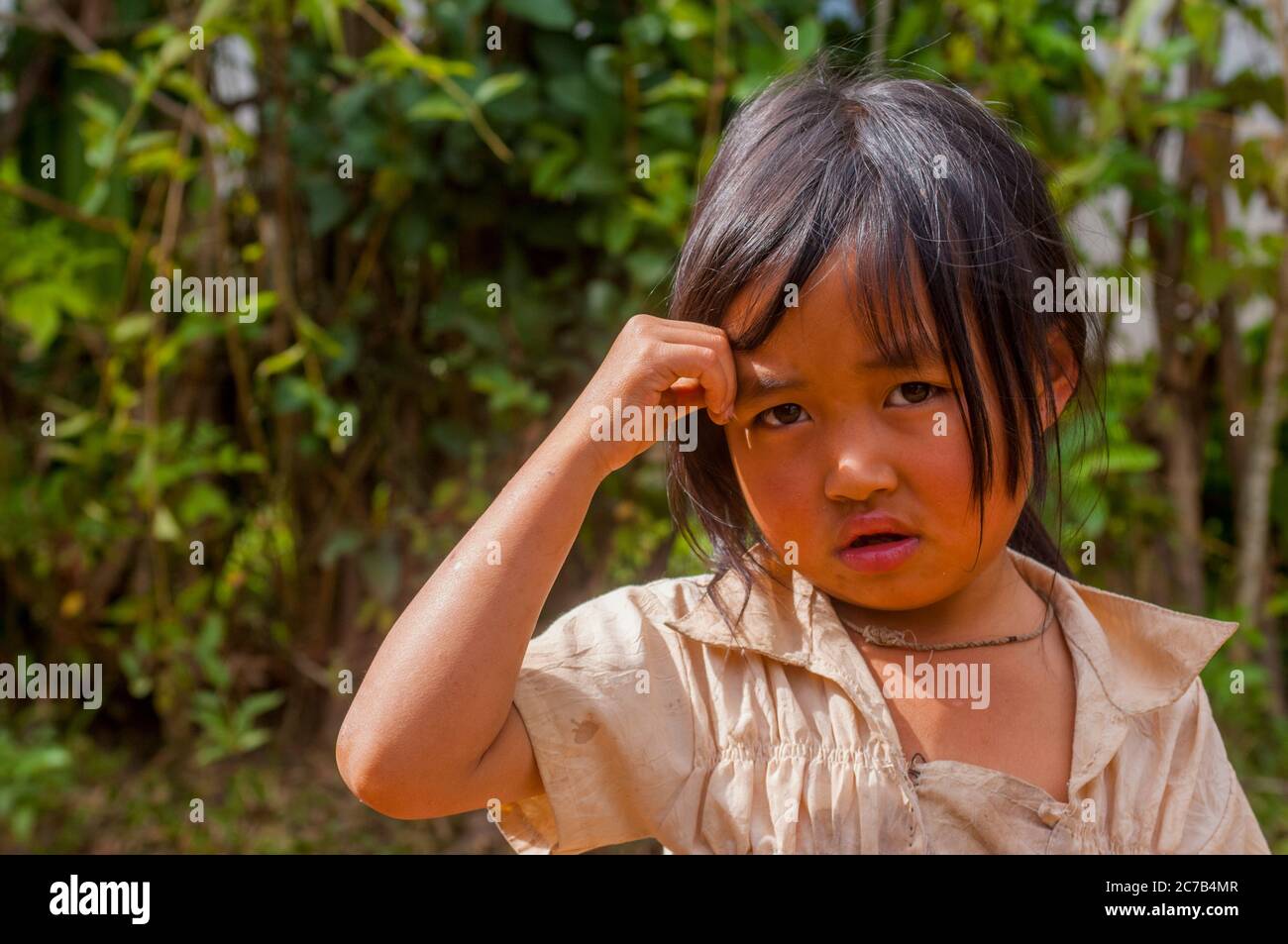 Portrait of a Hmong girl in a village near Phonsavan (originally known ...