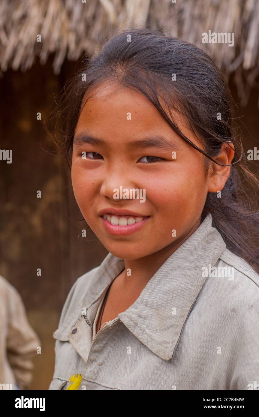 Portrait of a Hmong girl in a village near Phonsavan (originally known ...
