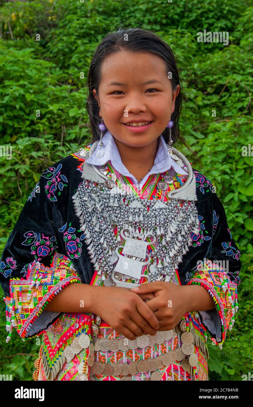 A Hmong teenage girl in a traditional festive dress in a village near ...