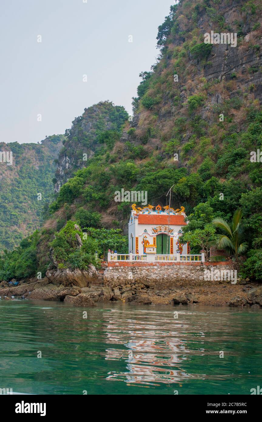 A small temple on an island at a floating village in Halong Bay (UNESCO ...
