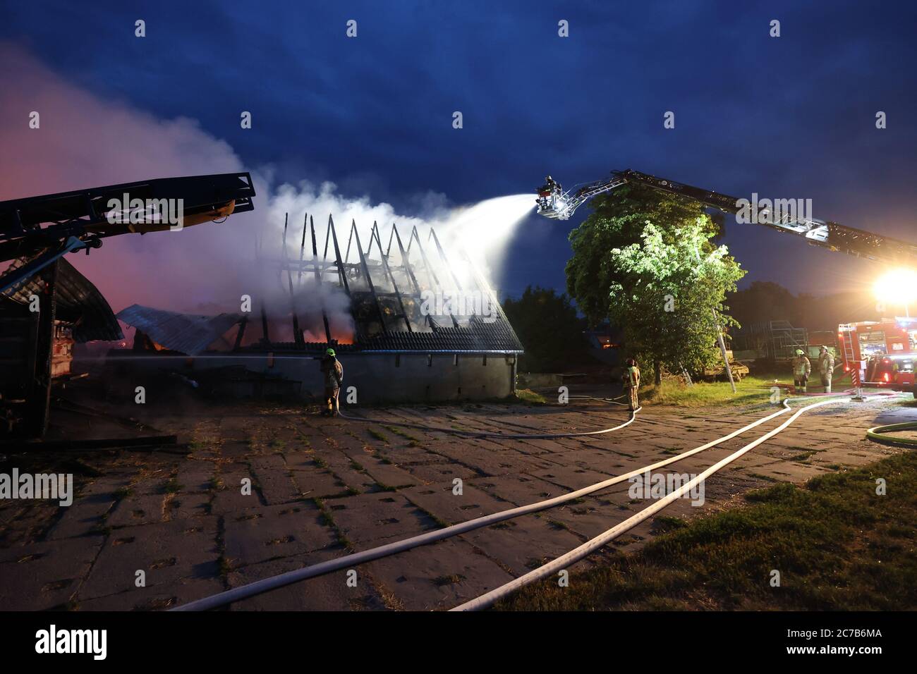 Altenburg, Germany. 16th July, 2020. Firefighters fight a fire on a ...
