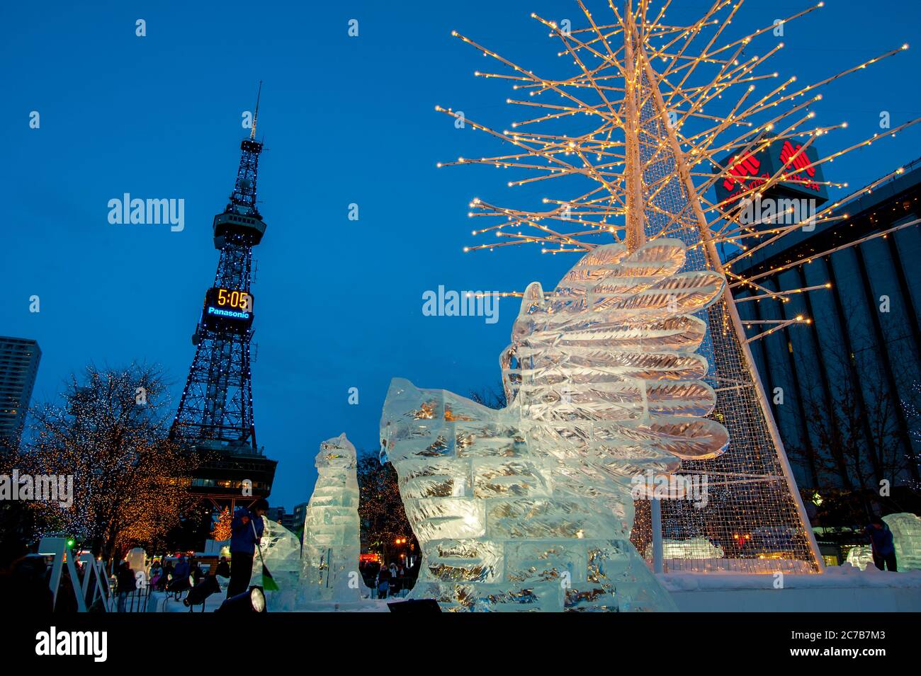 Ice sculptures illuminated at night at the Sapporo Snow Festival in ...