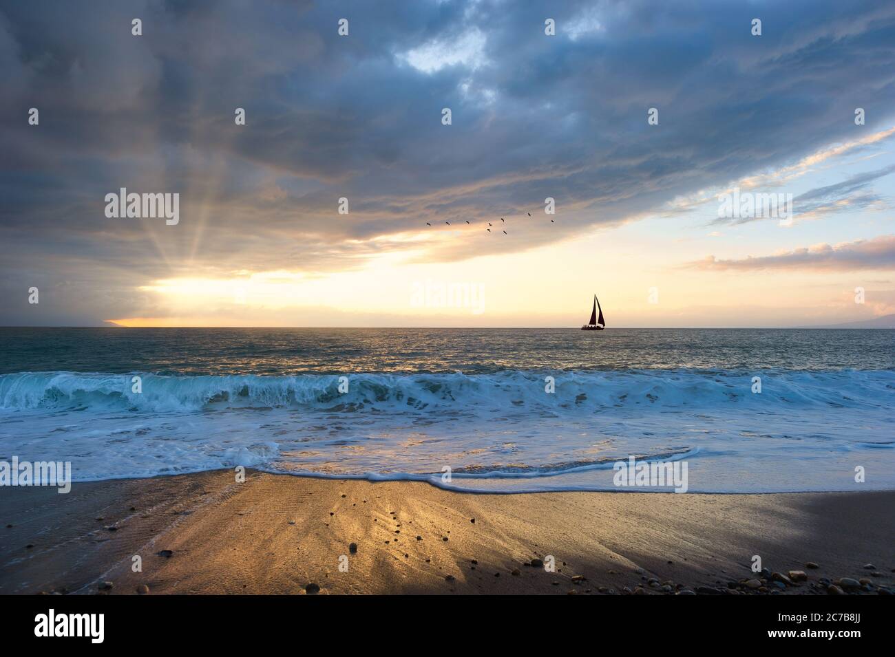 A Beautiful Sunset With a Boat Sailing along the Ocean Water As Sun ...