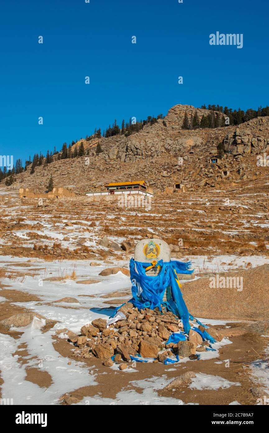 A stone statue with a prayer flag at the Manjusri Monastery, a former ...