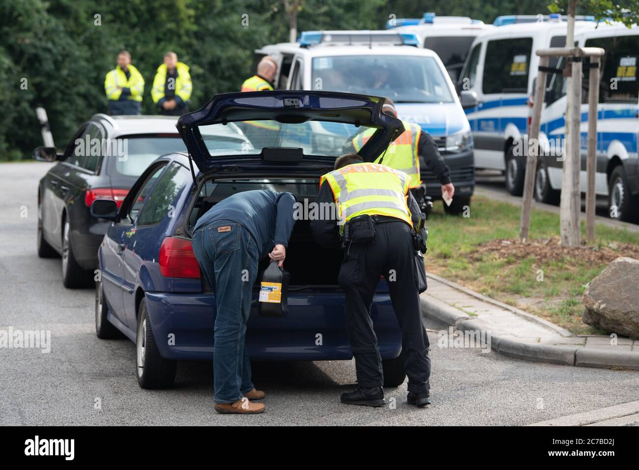 Bautzen, Germany. 16th July, 2020. A police officer inspects the trunk ...