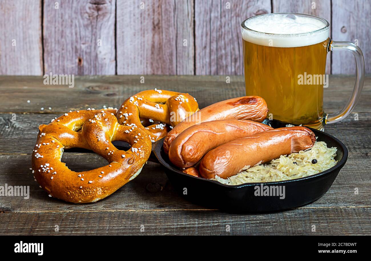 Oktoberfest traditional food. German sausages bratwurst with sauerkraut ...