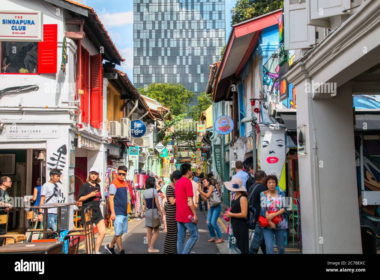 tourists walking in the famous colourful streets of Sultan Mosque ...