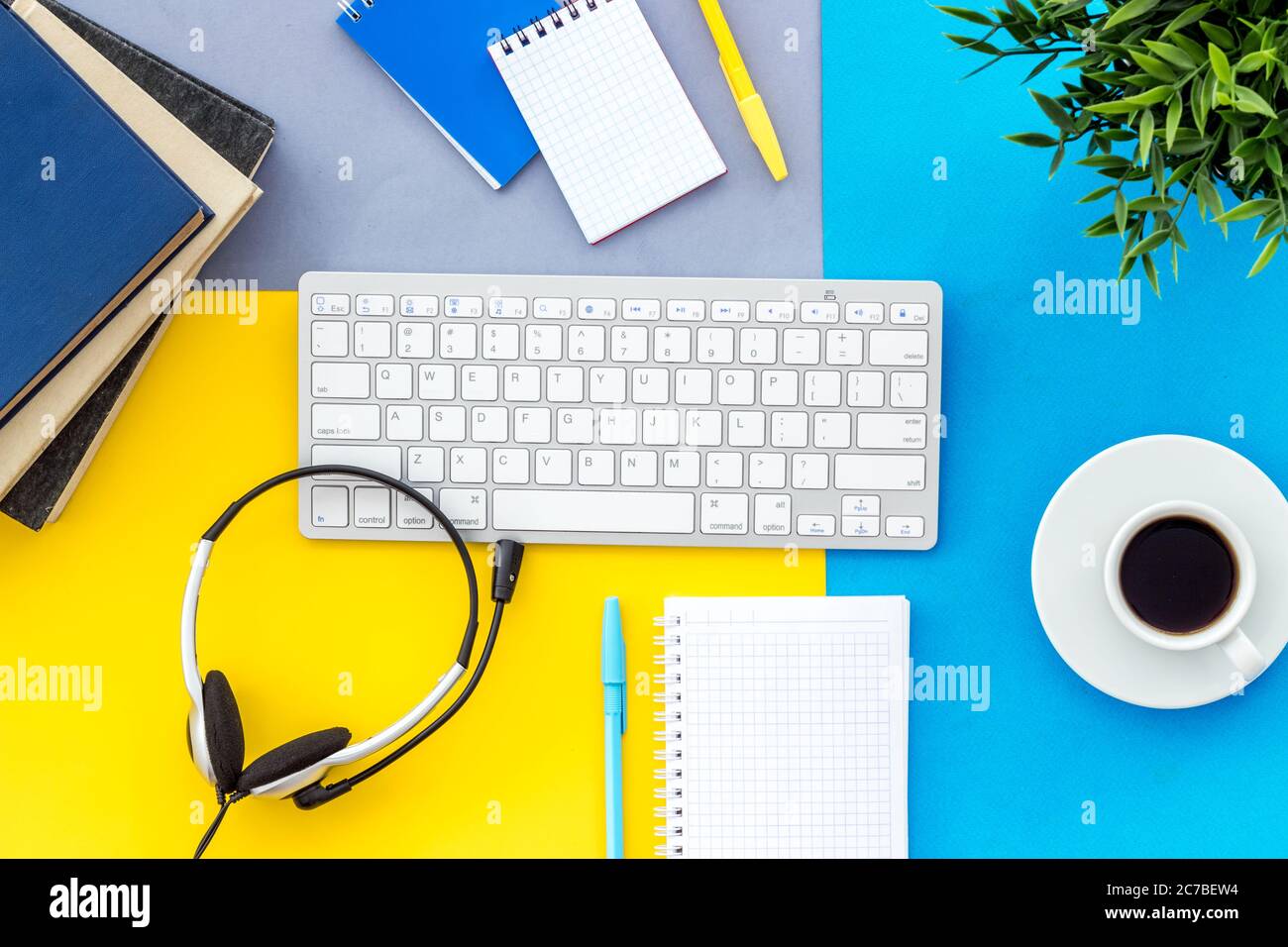 E-learning, online course. Computer, book and headphones on colorful ...