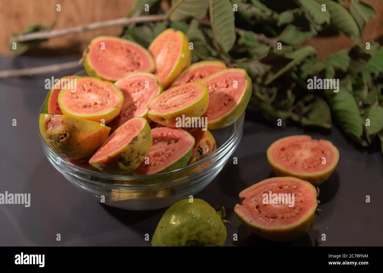 Guava fruits in halves. Guava is the fruit of guava, a tree of the ...