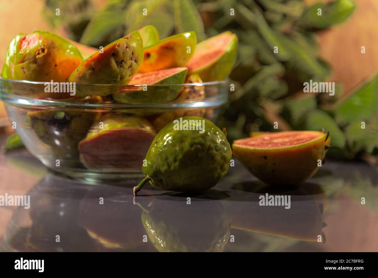 Guava fruits in halves. Guava is the fruit of guava, a tree of the ...