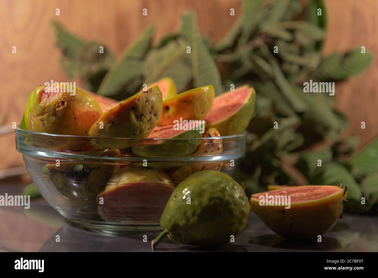 Guava fruits in halves. Guava is the fruit of guava, a tree of the ...