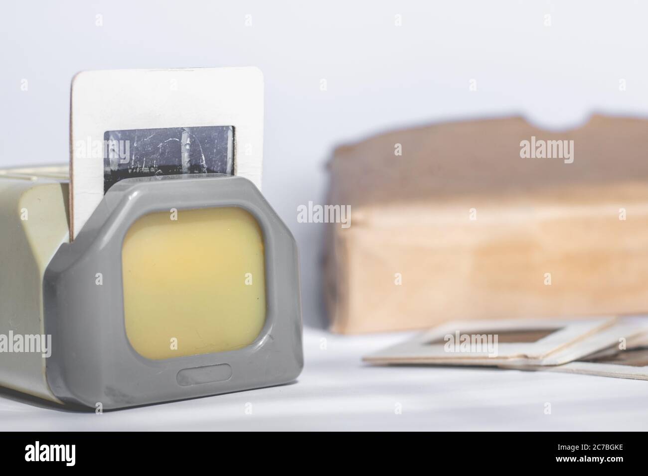 Vintage photographs with memories and a diascope Stock Photo - Alamy