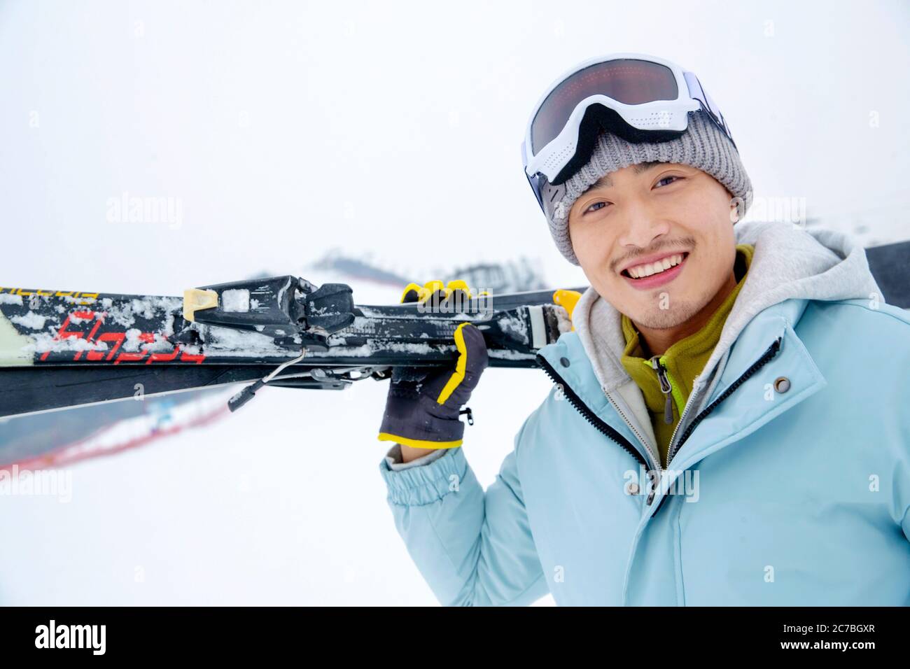 Tourist holding skis hi-res stock photography and images - Alamy