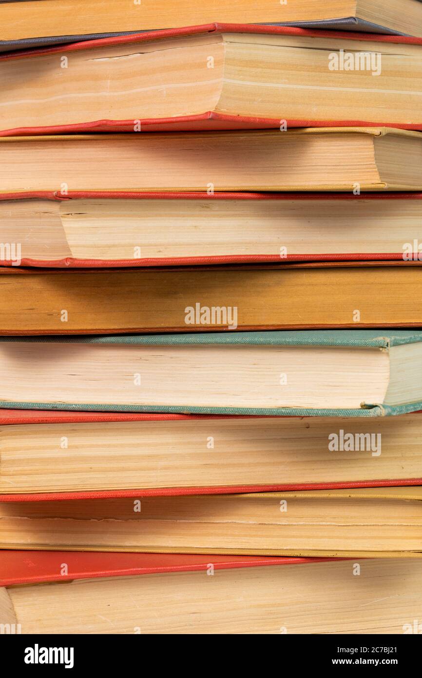 abstract books background - old red and muted green ones in a vertical ...