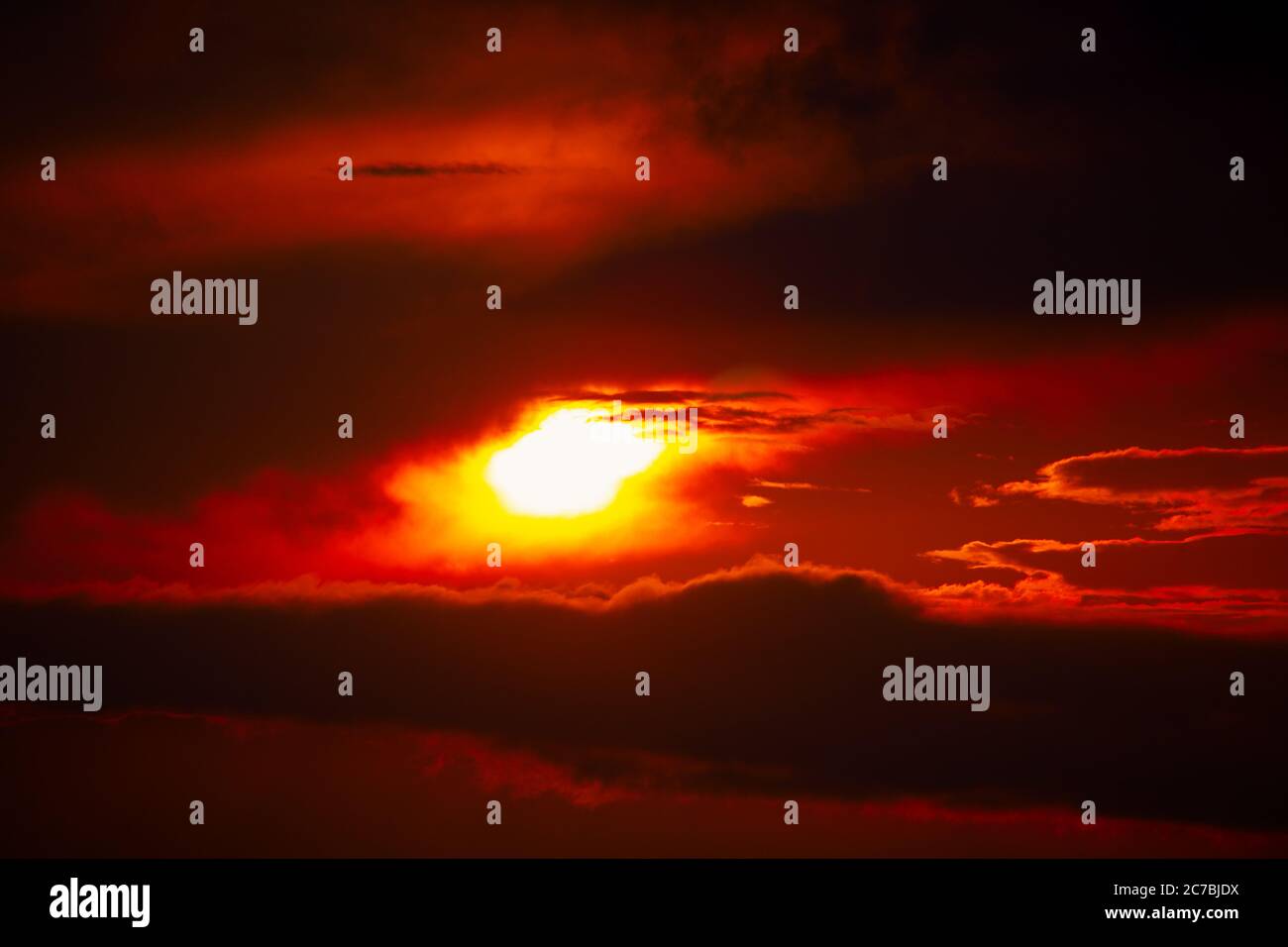 Sun Flash at the Red Evening Sky Stock Photo - Alamy