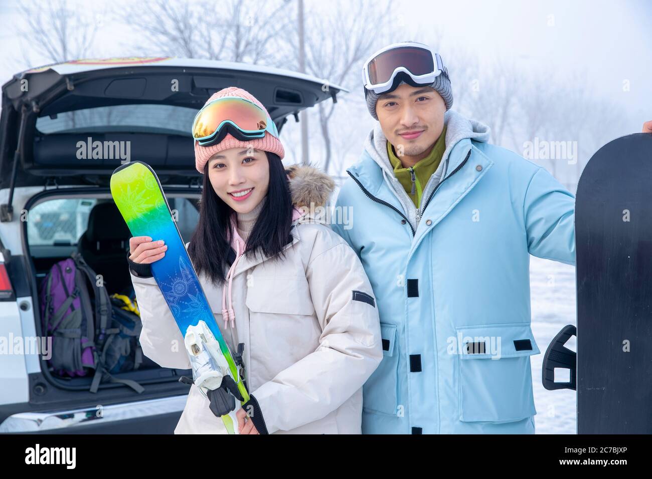 Holding skis together hi-res stock photography and images - Alamy