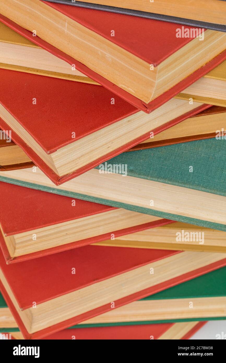 abstract books background - old red and muted green ones in a vertical ...
