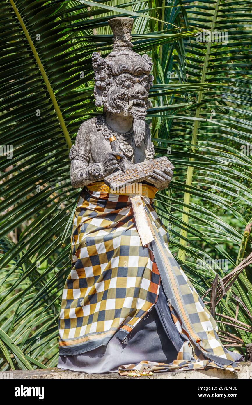 Statue of Sang Suratma god at Balinese Hindu Pura Dalem (Temple of the ...