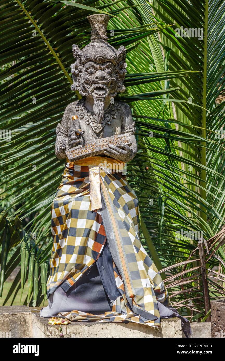 Statue of Sang Suratma god at Balinese Hindu Pura Dalem (Temple of the ...
