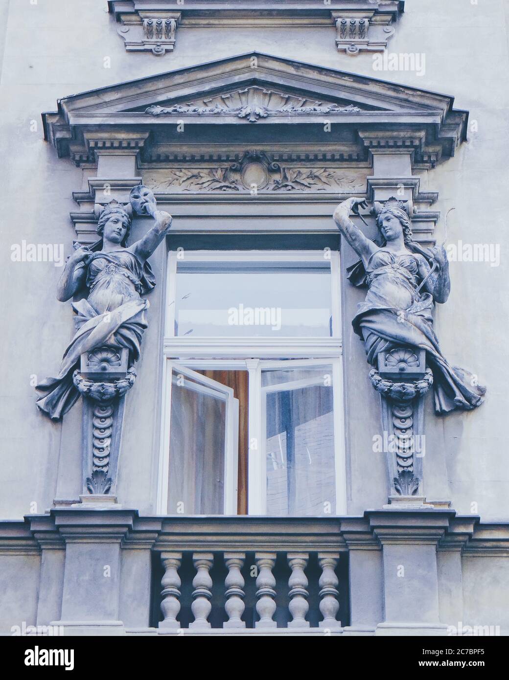 Window pediment with sculptures Stock Photo - Alamy