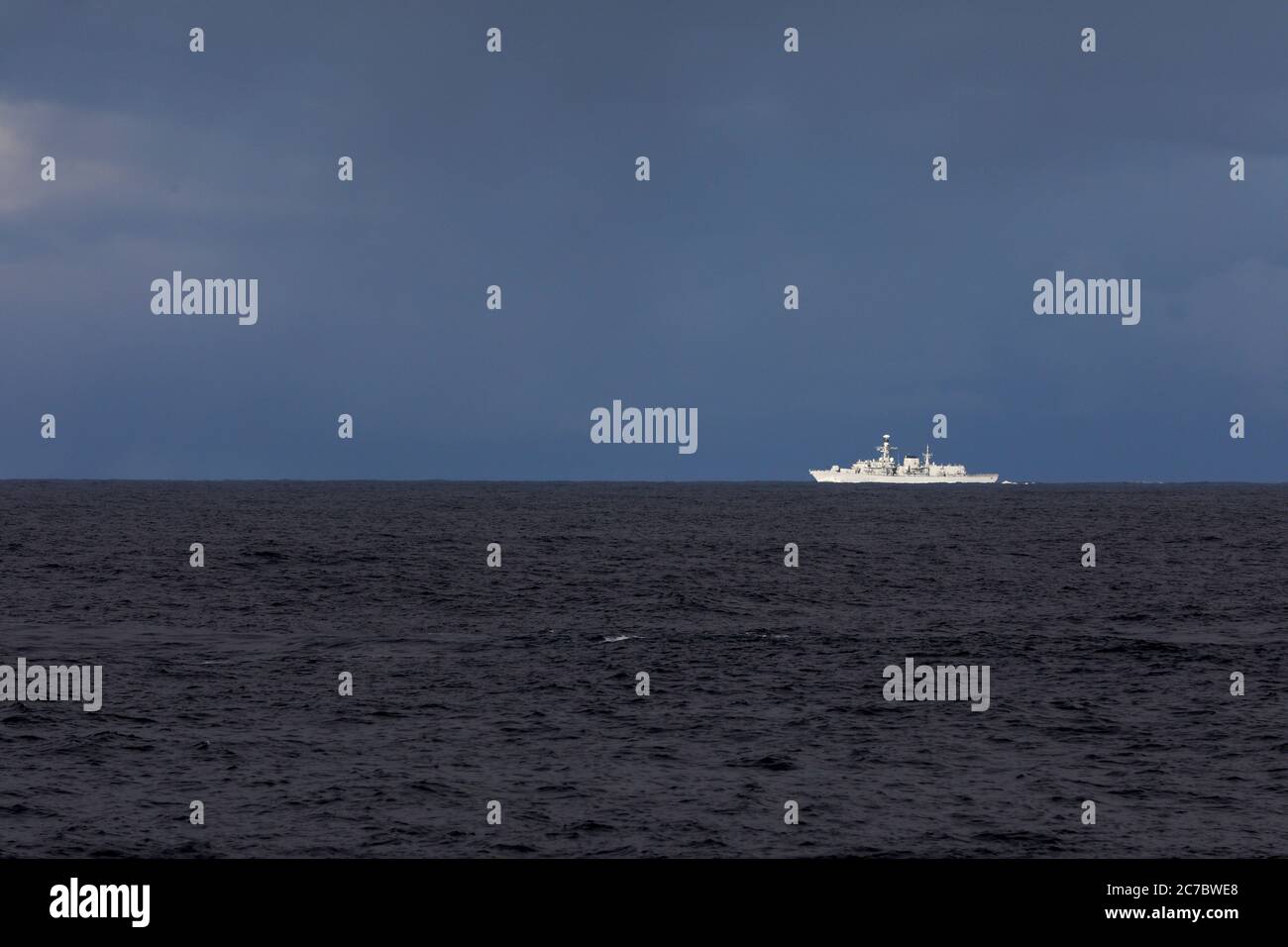 A British Type 23 frigate on the horizon Stock Photo - Alamy