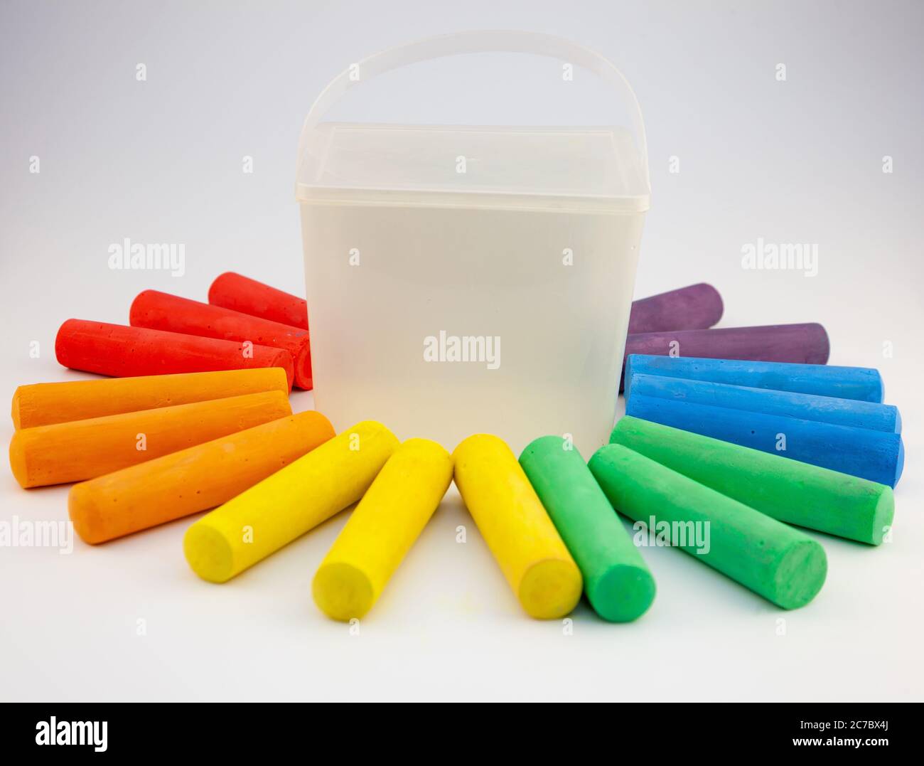Set of colorful chalks in plastic box isolated on white background ...
