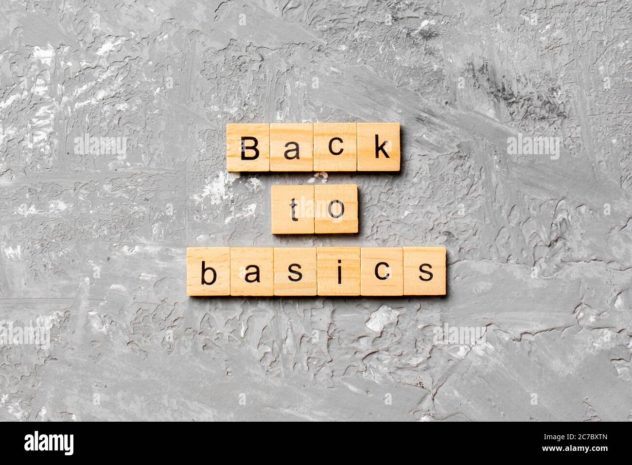 back to basics word written on wood block. back to basics text on table ...